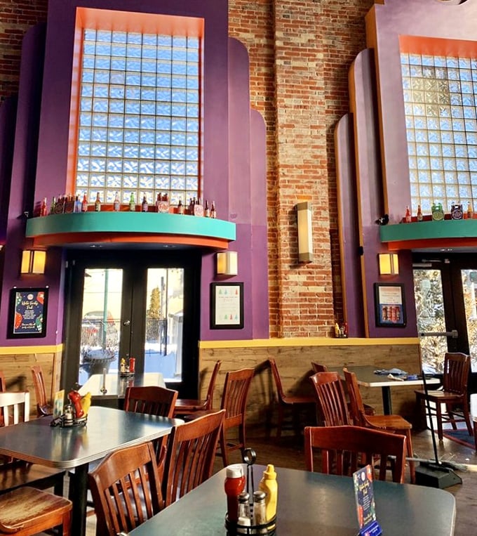 Step inside and you're greeted by exposed brick, purple accents, and glass block windows that create a perfect blend of nostalgic charm and industrial cool.