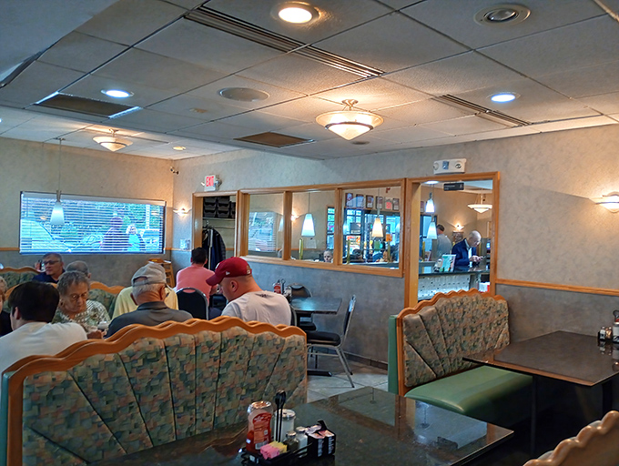 Cozy booths where strangers become neighbors and calories don't count. The gentle hum of conversation is the restaurant's secret ingredient.