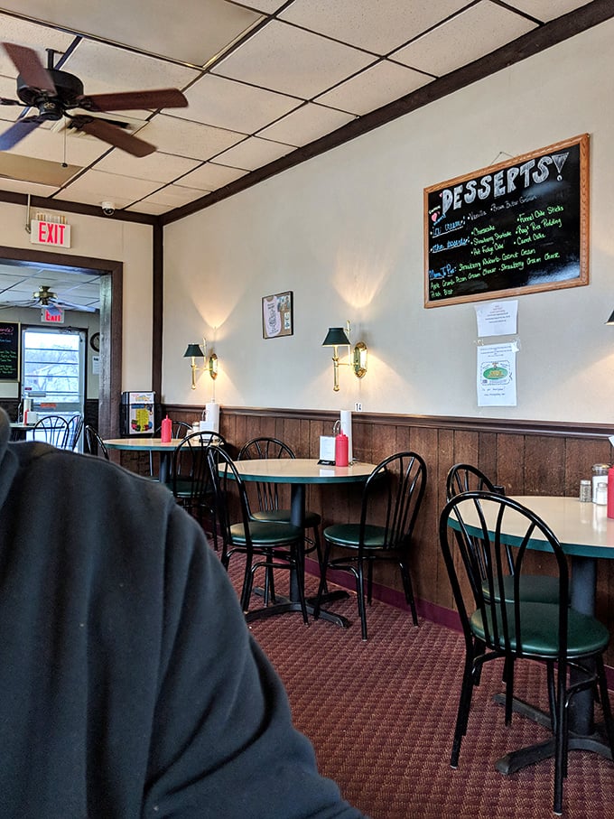 White tablecloths, wooden chairs, and fresh flowers create that perfect balance of elegance and comfort&mdash;like dining at a sophisticated friend's country home.
