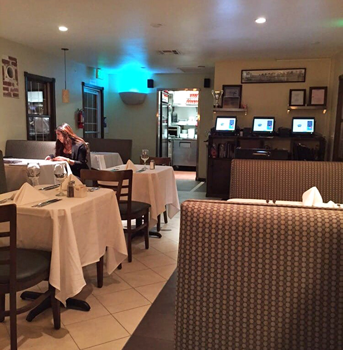 White tablecloths and cozy booths create an unexpected elegance in this desert gem, where comfort meets casual sophistication.