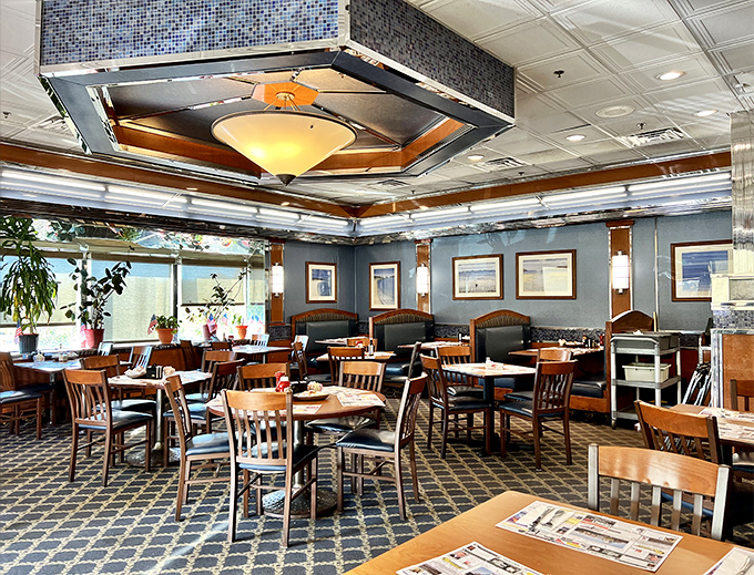 Blue walls, wooden chairs, and that unmistakable hexagonal ceiling fixture &ndash; diner design that whispers, "Settle in, we've got all day."
