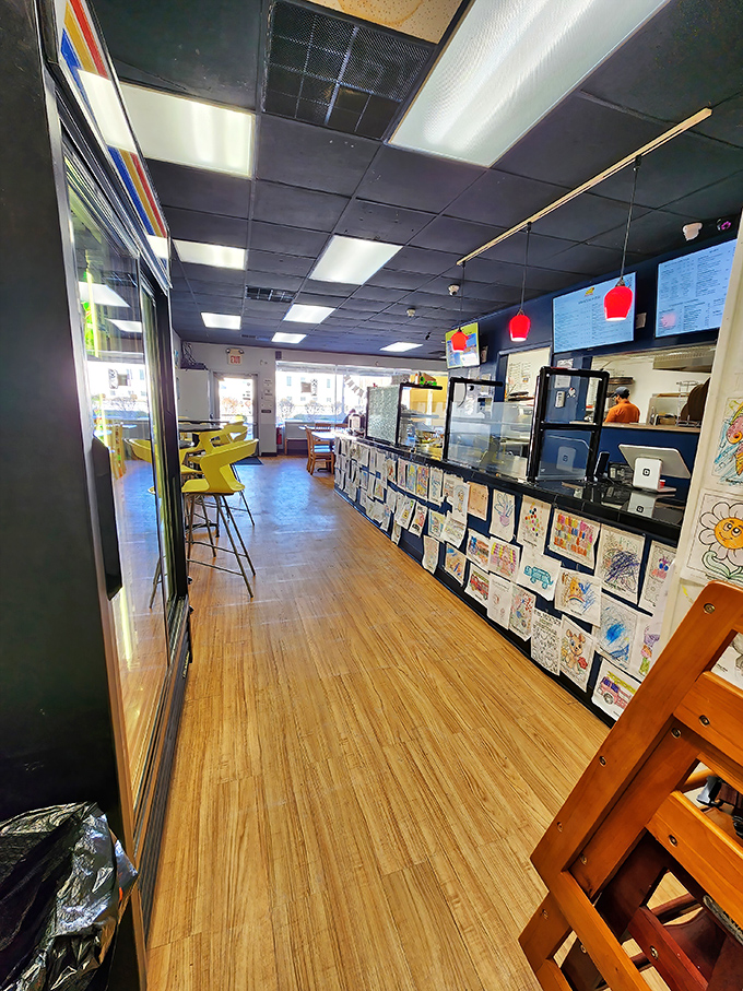 Children's artwork lines the counter &ndash; each crayon masterpiece a testament to Pizza Dive's family-friendly heart and soul.