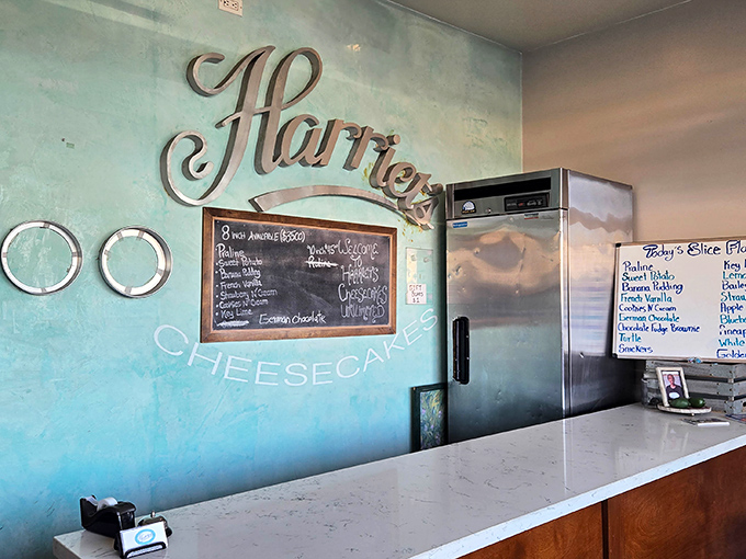 Step inside and the turquoise walls whisper secrets of cheesecake mastery while the handwritten menu board tempts you with flavors you'll dream about later.