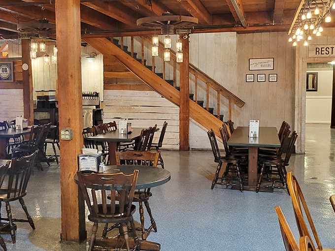 Exposed wooden beams, rustic stairs, and that unmistakable barn-like charm create an atmosphere that's equal parts nostalgic and inviting.