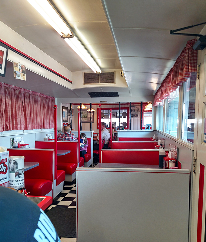 Step inside and the classic diner formula reveals itself: red vinyl booths, checkered floors, and gingham curtains that haven't changed since your grandparents' first date.