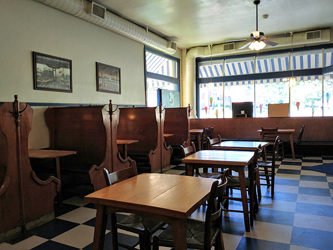 These high-backed wooden booths have witnessed more first dates, celebrations, and "diet starts tomorrow" promises than a confessional.