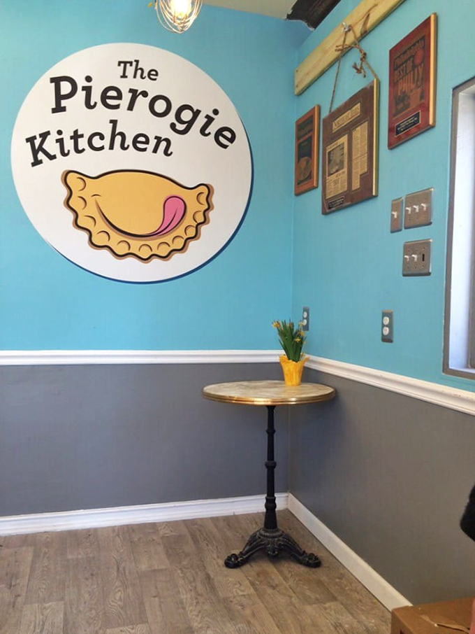 The warm blue and white interior creates the perfect backdrop for serious dumpling contemplation and neighborhood conversations.