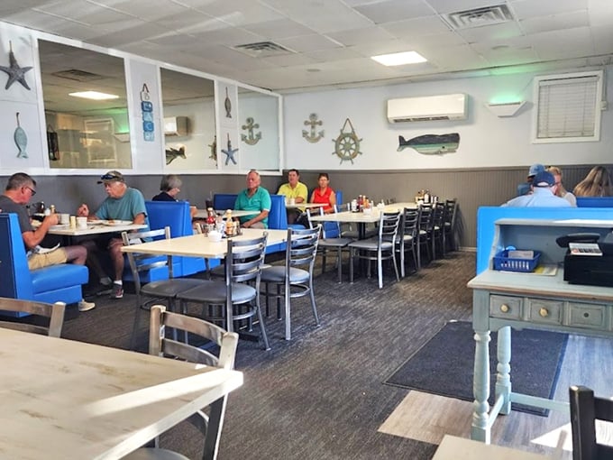 Nautical decor meets classic diner comfort inside Apollo Beach Diner. The blue booths and maritime accents create a welcoming atmosphere that feels quintessentially Florida.