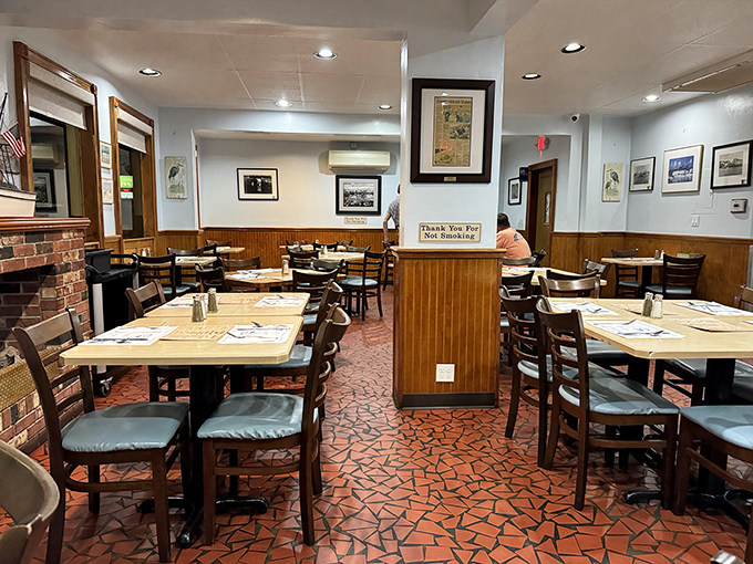 Wood paneling and no-nonsense tables create that rare dining atmosphere where conversations matter more than Instagram opportunities.