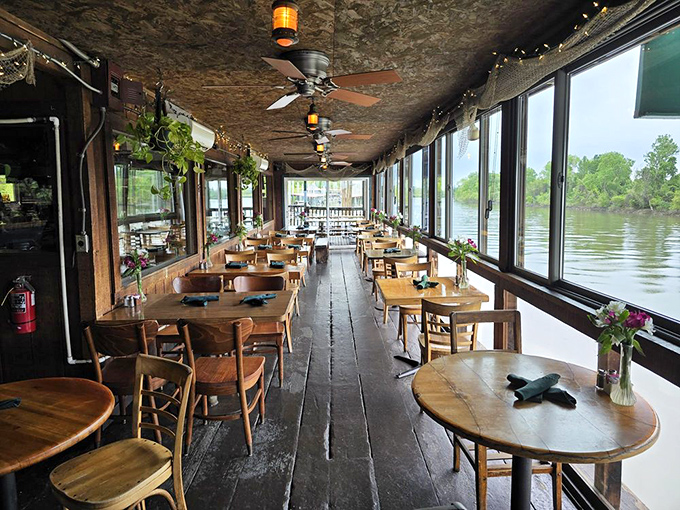 Rustic wooden floors and panoramic river views create the perfect backdrop for seafood feasting. Mother Nature provides the entertainment here.