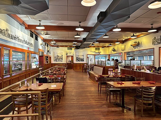 Warm wood tones, nautical artwork, and just the right lighting &ndash; this dining room feels like the captain's quarters of a particularly successful fishing vessel.