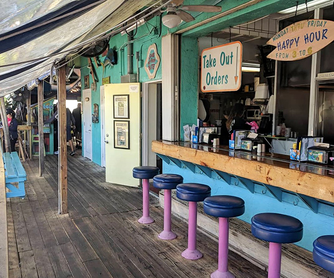 Pull up a pink-legged stool at the counter where beach vibes meet comfort food. The weathered wood floors tell stories of countless sandy feet.