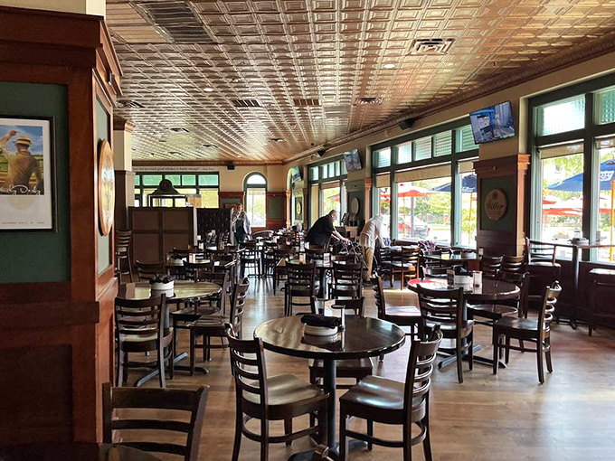 Step inside to discover a dining room where the stunning pressed tin ceiling reflects both light and laughter, creating the perfect backdrop for memorable meals.