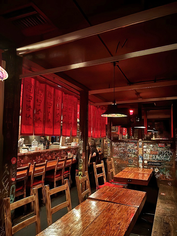 Step inside and the red-hued lighting transforms ordinary evenings into extraordinary experiences. Those graffiti-covered walls tell stories of countless memorable nights.