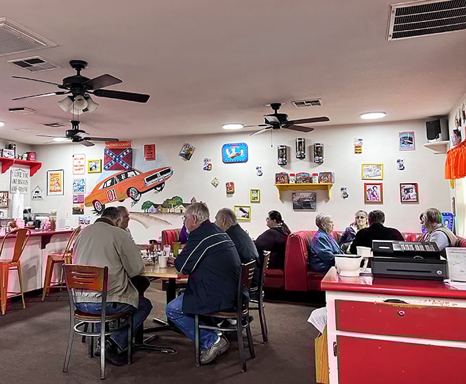Inside, Dukes of Hazzard memorabilia meets classic diner charm. The General Lee car cutout watches over locals sharing stories across red vinyl booths.