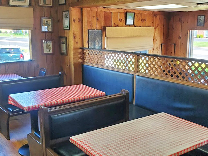 Classic blue booths and red checkered tablecloths – the universal signal that you're about to experience comfort food that hasn't changed since your parents' first date.
