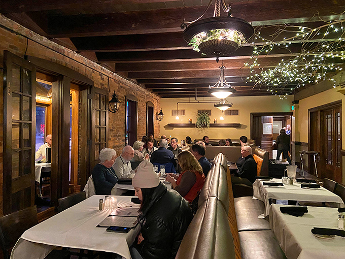 Twinkling string lights create a magical canopy above diners, while exposed brick walls whisper stories of Fort Wayne's industrial past.