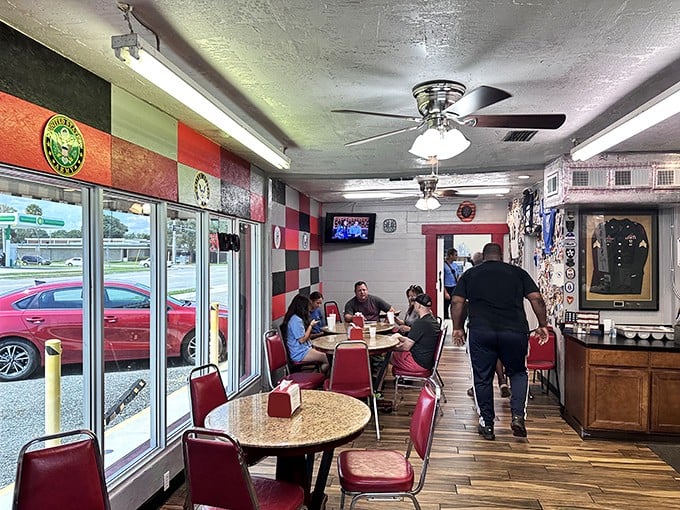 Inside, the checkered walls and military memorabilia create a cozy atmosphere where NASA employees and locals share tables and stories.