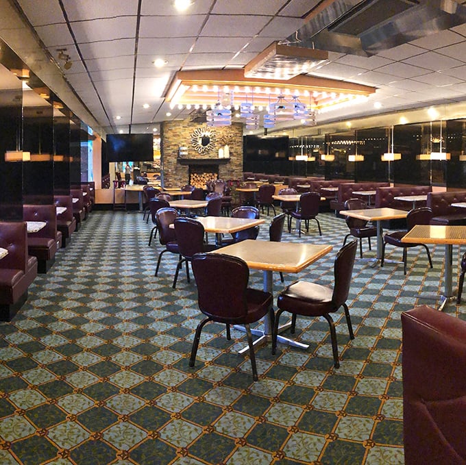 Step inside and you're greeted by that perfect diner ambiance&mdash;burgundy booths, patterned carpet, and lighting that makes everyone look like they're ready for dessert.
