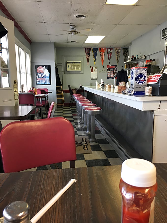 Classic red vinyl stools line the counter where breakfast dreams come true. This isn't Instagram-friendly d&eacute;cor&mdash;it's the real deal.