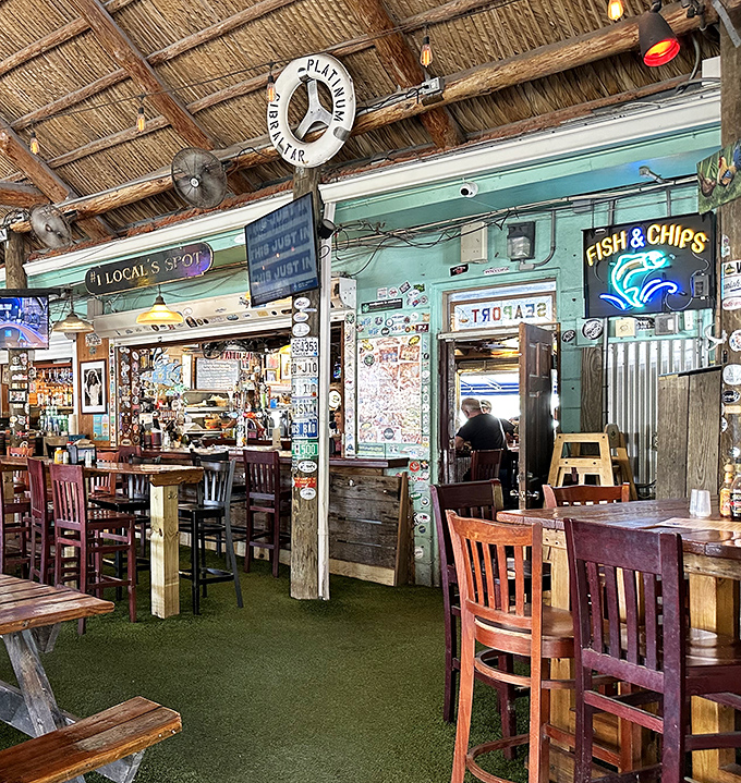 Inside Hogfish, mismatched furniture and maritime memorabilia create that rare authentic atmosphere money can't buy but stories naturally build.