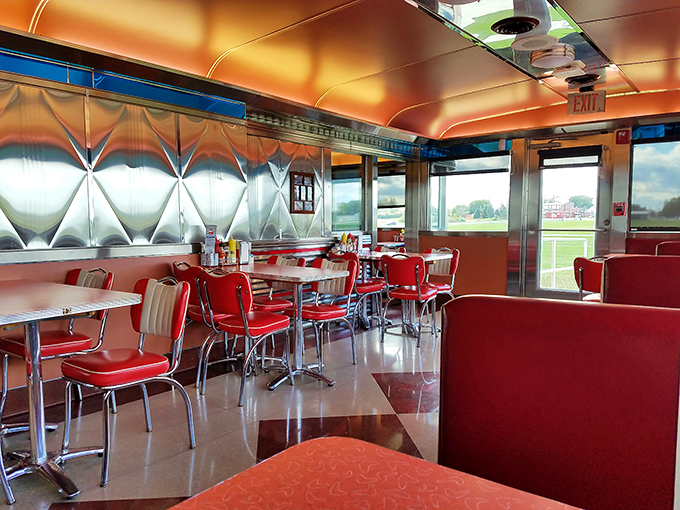 Inside, cherry-red vinyl booths and polished chrome transport you to the golden age of diners, when Elvis was king and milkshakes came with the metal mixing cup.