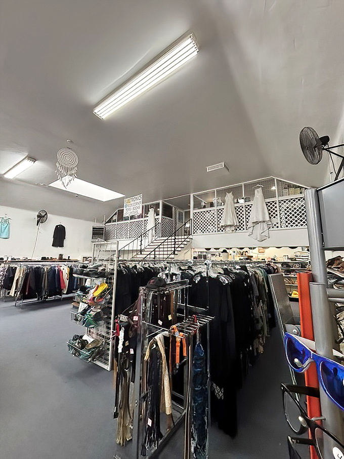 Two-level shopping paradise where clothing racks stretch like an ocean of possibilities, each aisle a new adventure waiting for the curious bargain hunter.