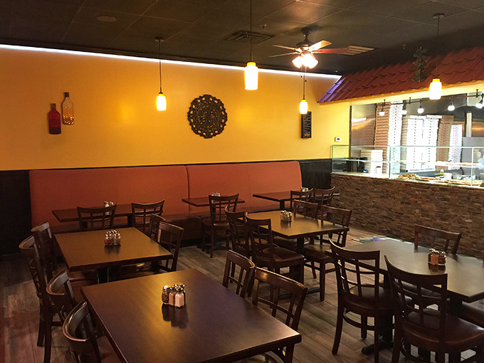 Warm yellow walls and cozy seating create that "everybody knows your name" vibe. The kind of place where calories don't count.