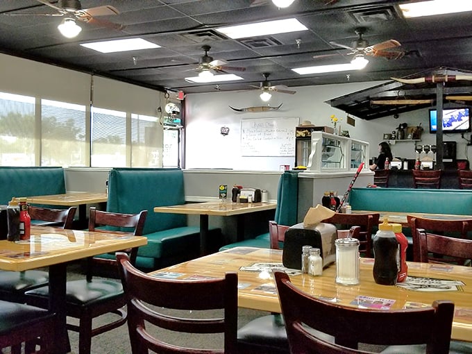 Classic teal vinyl booths and wooden tables create that perfect diner atmosphere where comfort food memories are made.