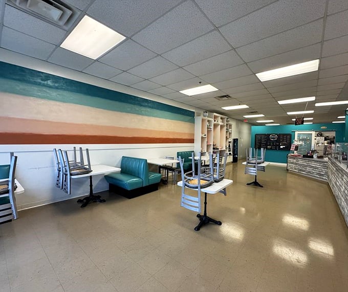 Industrial-chic meets comfort in this dining room where metal chairs and wooden tables create the perfect backdrop for barbecue bliss.