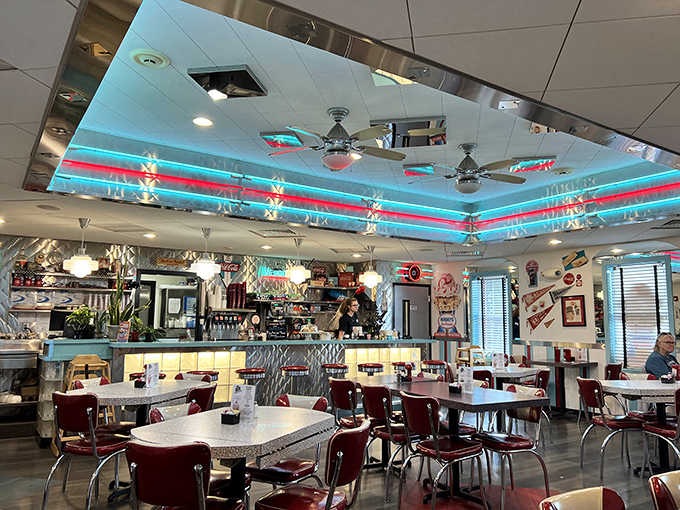 Step inside and the first thing that hits you: those mesmerizing blue and red ceiling lights, creating an atmosphere that would make The Fonz feel right at home.