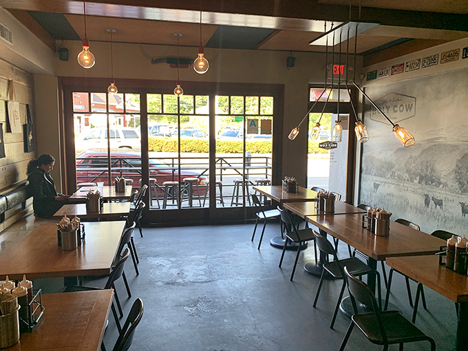 Industrial-chic meets comfort zone, where exposed beams and metal chairs create the perfect backdrop for serious meat consumption.