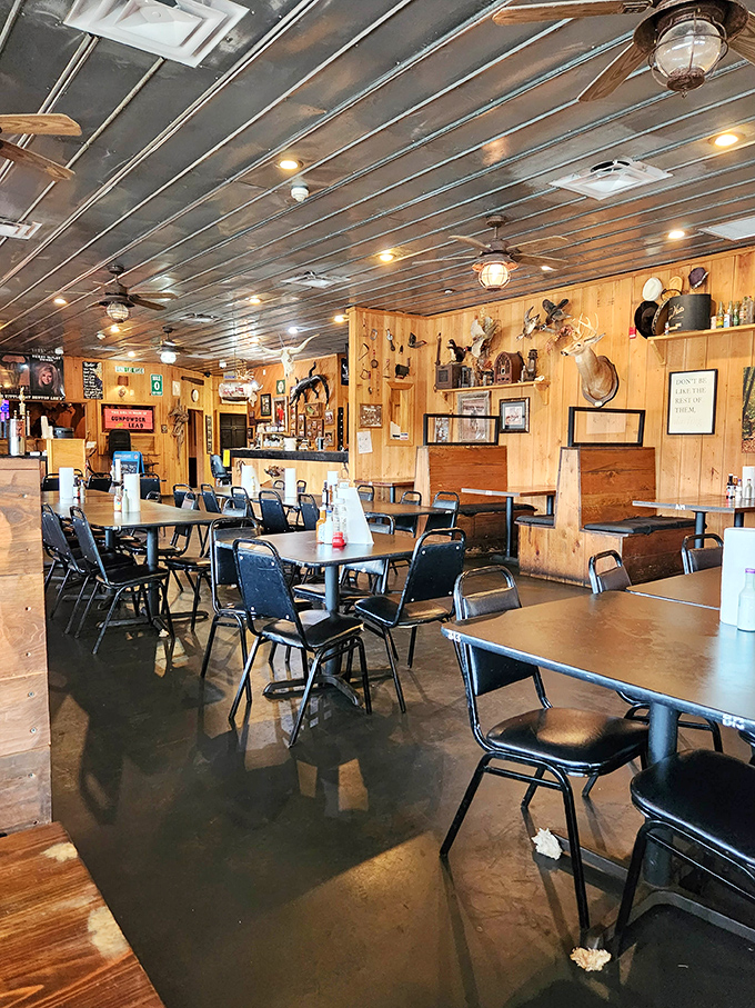 Inside, wood-paneled walls adorned with hunting trophies create the perfect backdrop for serious steak consumption. No pretension, just passion.