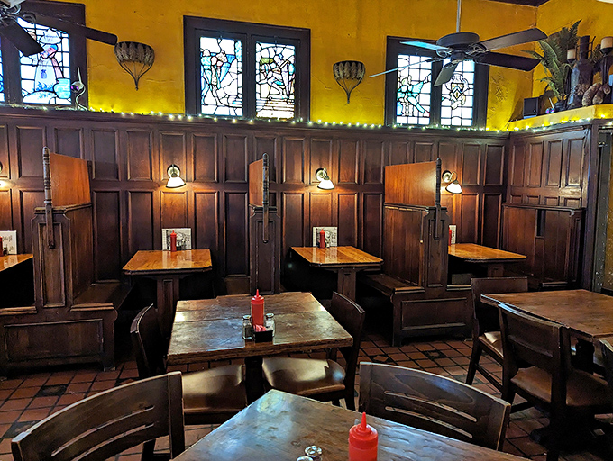 Church-like stained glass meets boxing memorabilia in this warm wooden sanctuary. The high-backed booths aren't just seating&mdash;they're ringside seats to culinary magic.