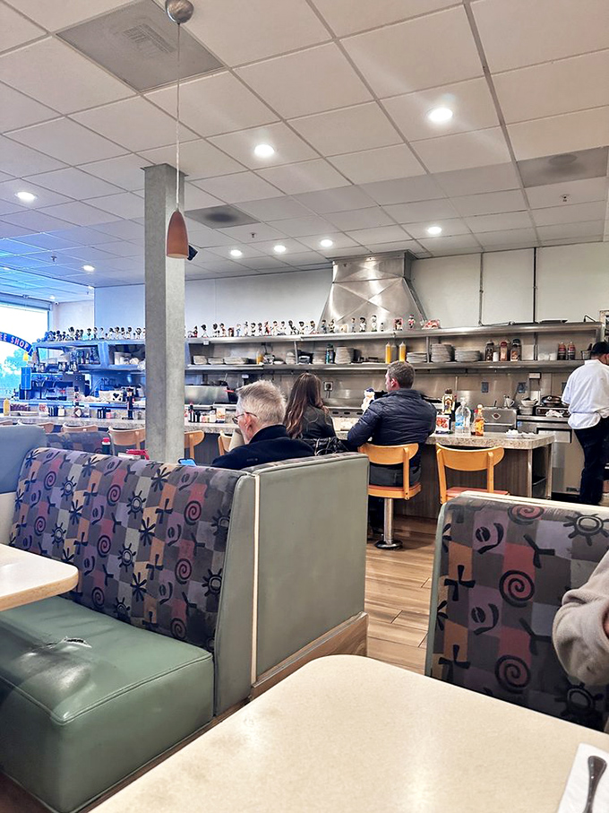 Where booths become thrones and counter seats offer front-row tickets to the breakfast symphony conducted in the open kitchen.