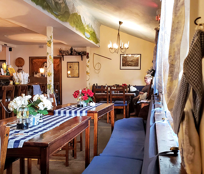 Step inside and you're transported straight to Bavaria&mdash;blue checkered tablecloths, warm wood, and decor that whispers "Gem&uuml;tlichkeit" without shouting "theme restaurant."