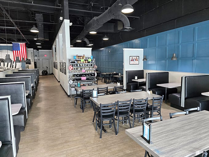 Clean lines, blue accent walls, and comfortable booths create that perfect sweet spot between modern design and classic diner comfort.