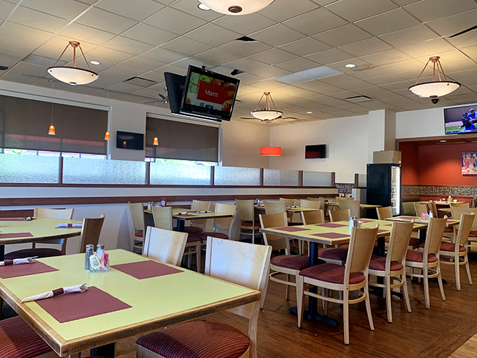 The dining room strikes that perfect balance between spacious and cozy, with warm lighting that makes everyone look like they just returned from vacation. 