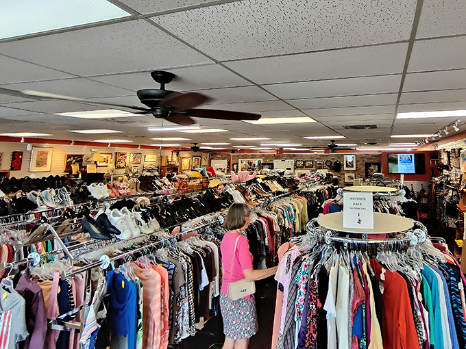 Racks upon racks of carefully organized clothing create a rainbow of possibilities where savvy shoppers hunt for designer labels at fraction-of-retail prices.