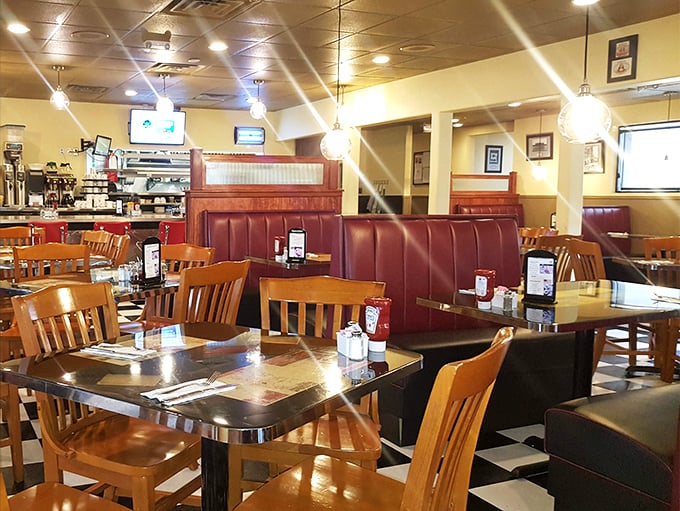 Blue vinyl booths and counter seating create that perfect "everybody knows your name" atmosphere where coffee refills appear like magic.