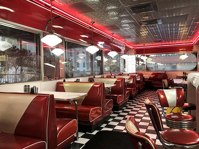 Step inside and time-travel to the golden age of diners—red vinyl booths, checkered floors, and pendant lights create the perfect backdrop for morning indulgence.