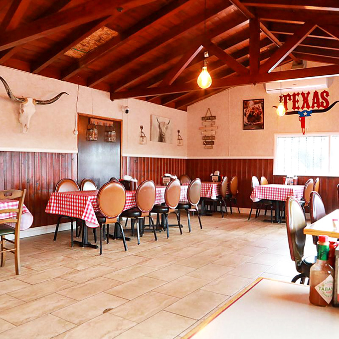 Red checkered tablecloths and exposed beams create the perfect backdrop for serious barbecue business.