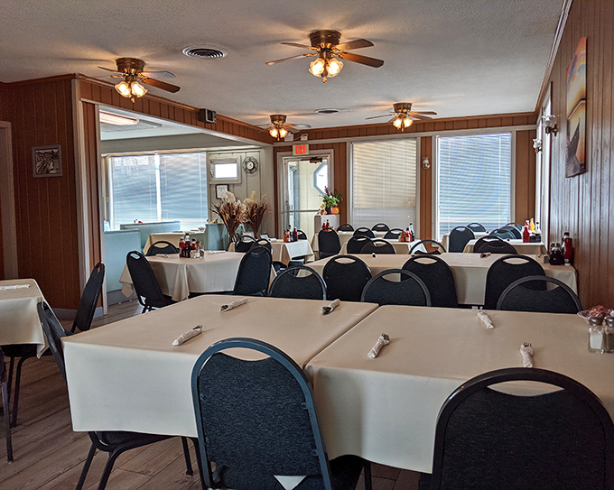 Wood-paneled walls and ceiling fans create the perfect atmosphere for serious omelet contemplation and coffee refills.