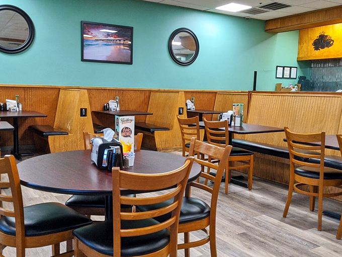 Cozy burgundy booths and warm wood paneling create the perfect backdrop for morning conversations. This isn't trendy d&eacute;cor&mdash;it's timeless diner comfort at its finest.