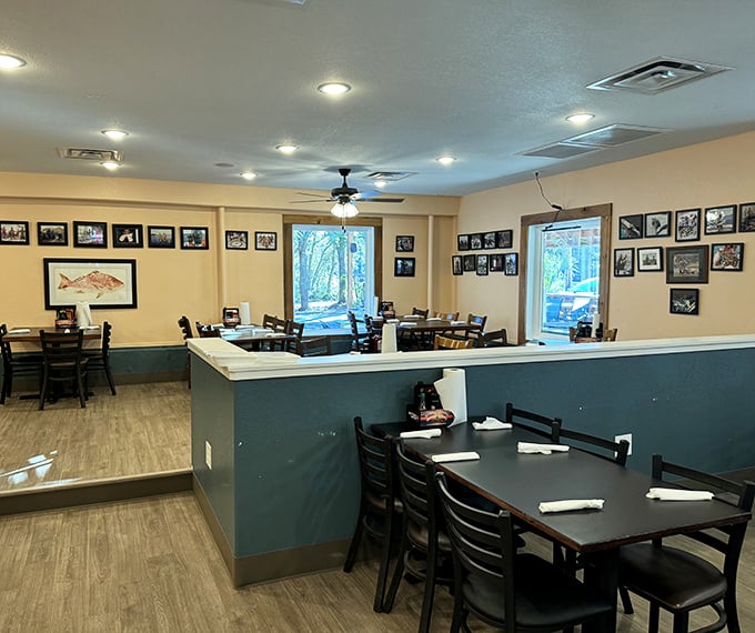 Simple, comfortable dining with walls adorned with fishing photos&mdash;visual appetizers before the main event begins.