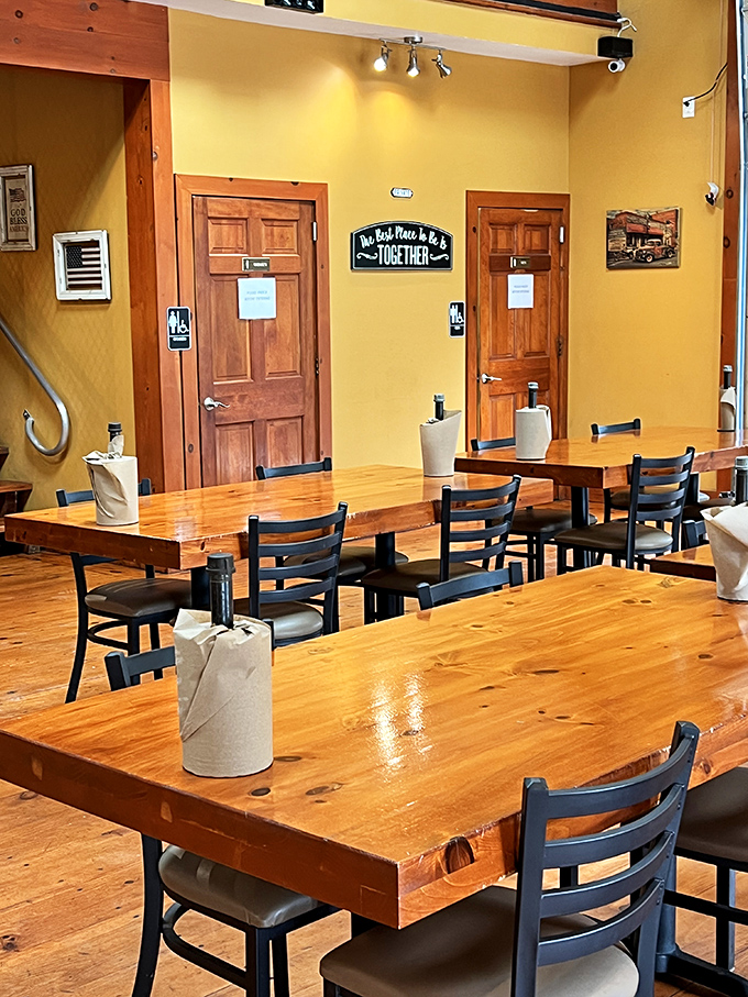 Warm yellow walls, sturdy wooden tables, and a sign reminding us that "The Best Place to Be is Together"&mdash;truer words were never hung above a barbecue joint.