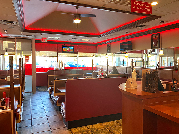 Exposed brick walls meet elegant lighting in this dining room that feels like the sophisticated living room you wish you had.
