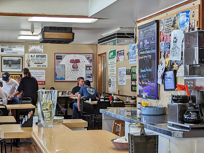 Warm wooden paneling, colorful stained glass, and a stone fireplace create the perfect setting for comfort food that hugs your soul.
