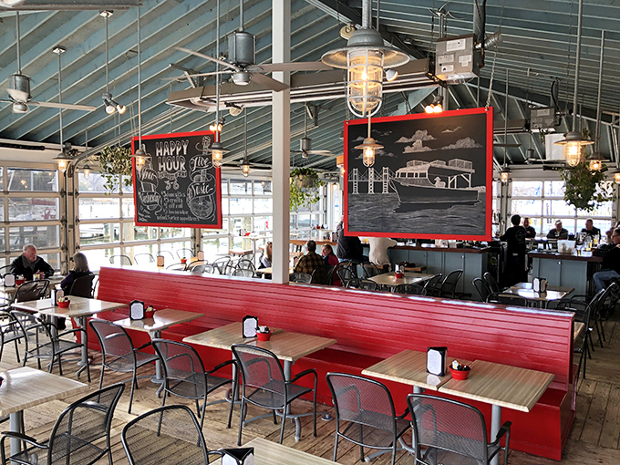 Inside, nautical charm meets modern comfort. Those chalkboard menus and industrial lighting create the perfect backdrop for seafood storytelling.