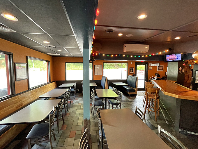 Inside, colorful string lights and cozy booths create the perfect setting for the serious business of barbecue appreciation.